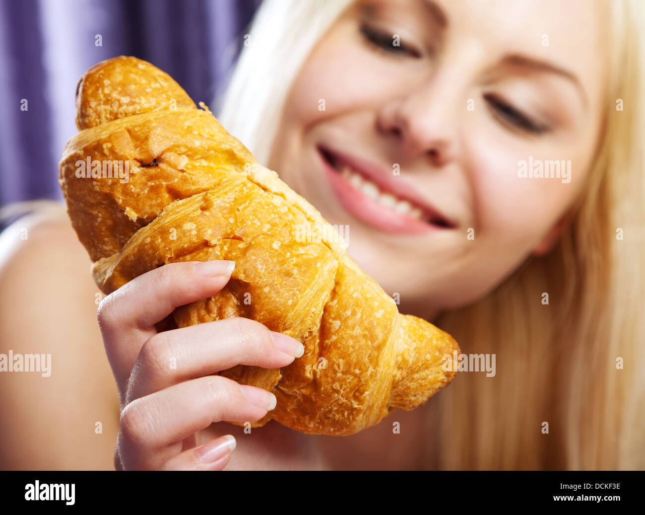 female holding croissant Stock Photo - Alamy
