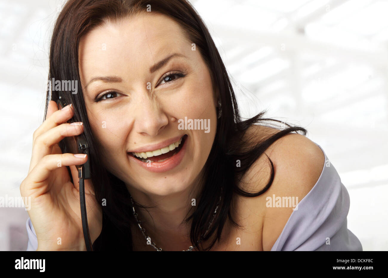happy face with a cellphone Stock Photo - Alamy