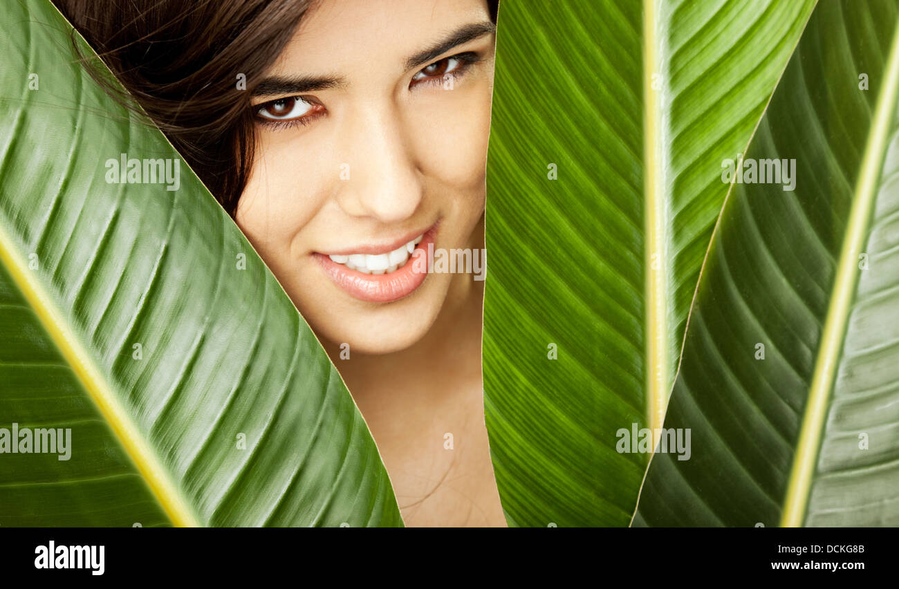 Girl smiling face leaves Stock Photo - Alamy