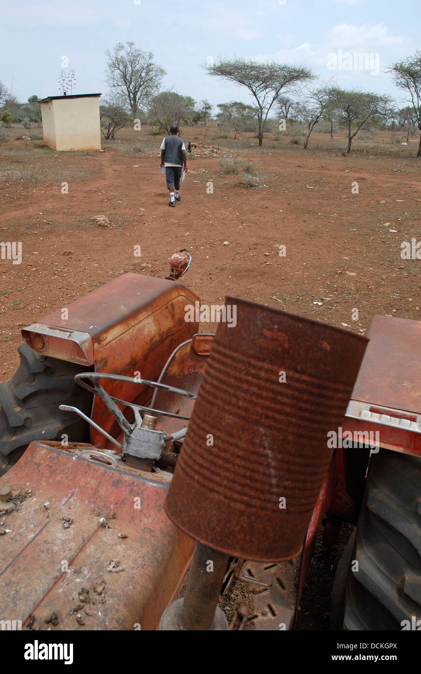Disused farming tools and vehicles litter a smallholding. Swaziland ...
