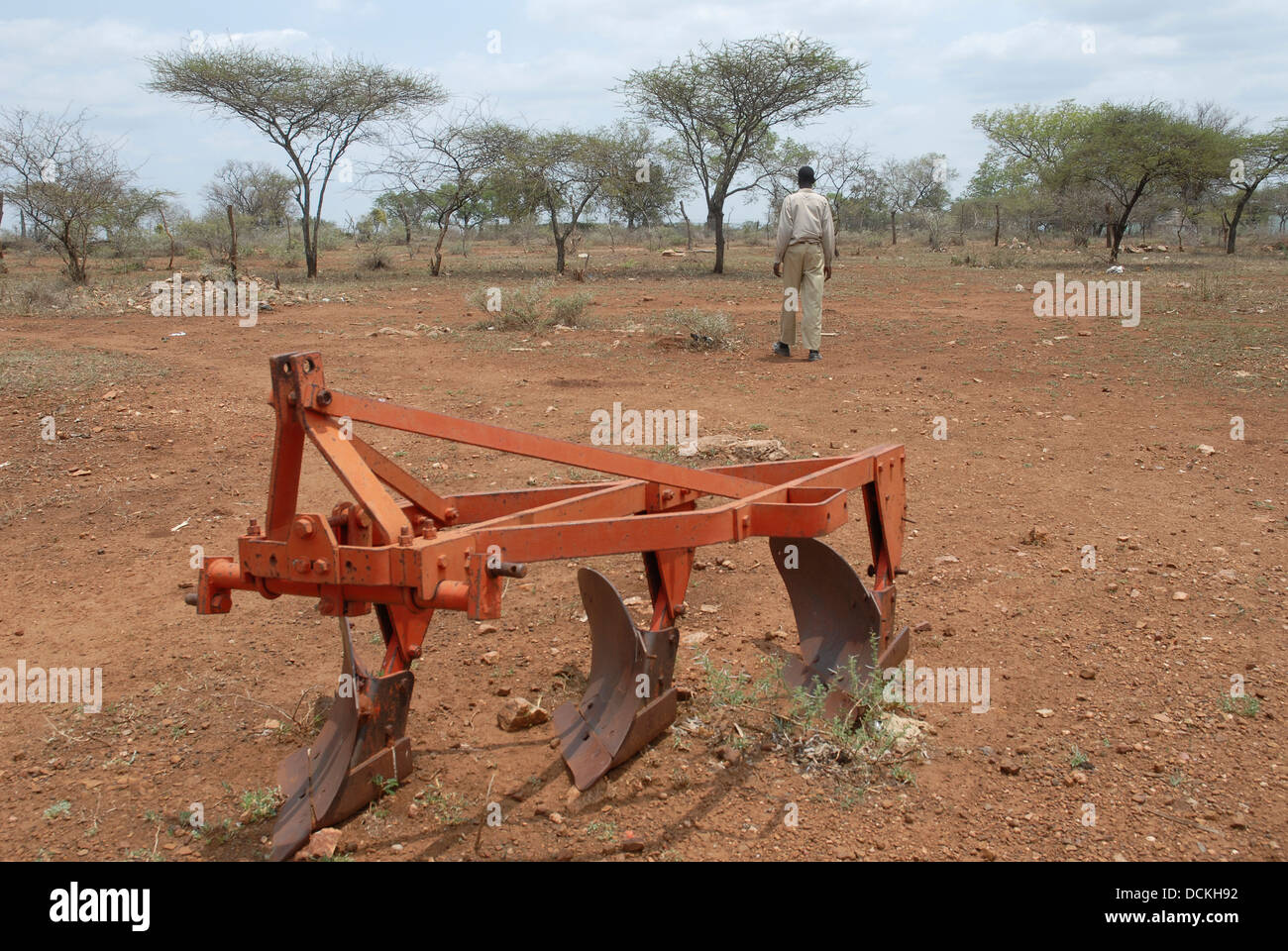 Disused farming tools and vehicles litter a smallholding. Swaziland ...