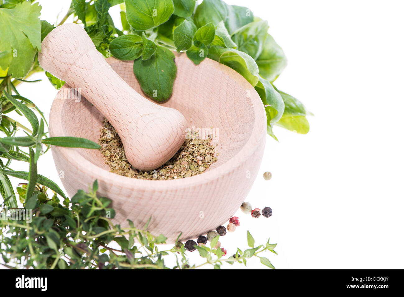 Some fresh Herbs in a wooden bowl isolated on white background Stock ...