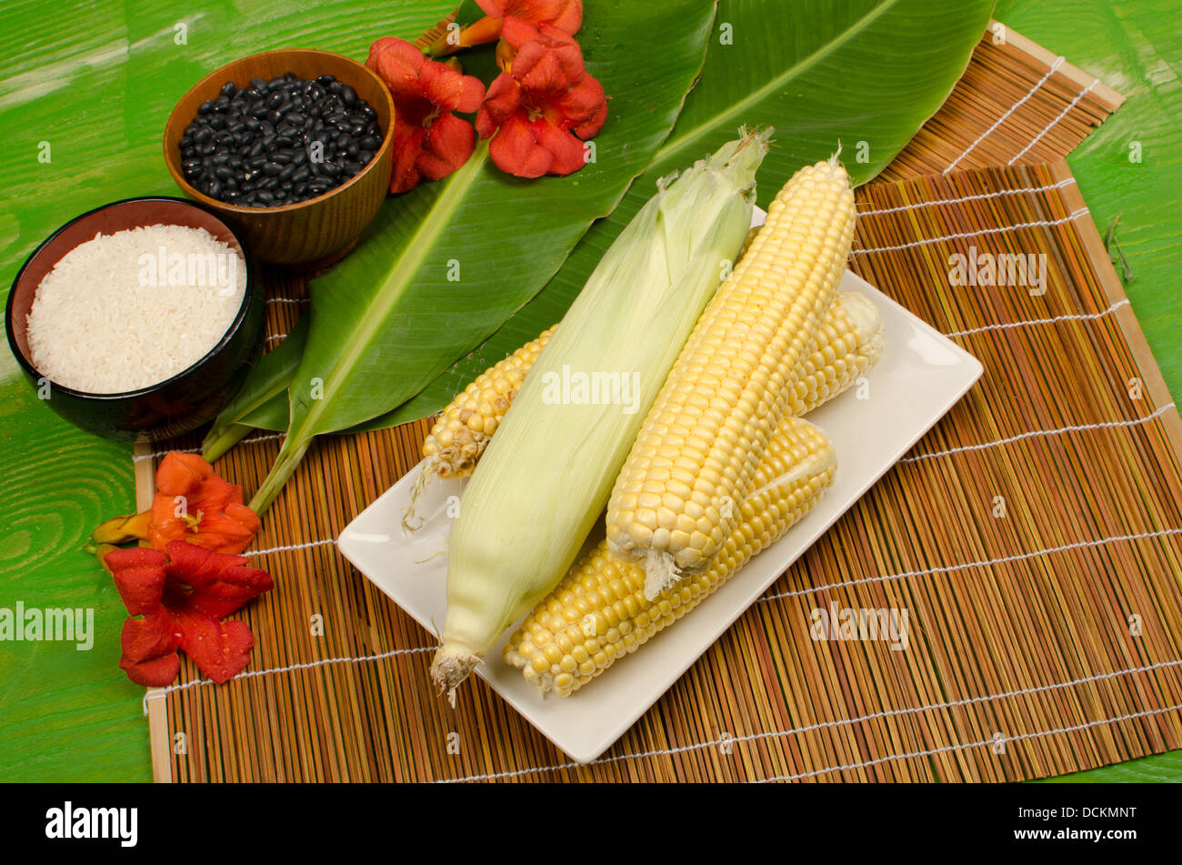 Corn on the cob in a still life with other Latin American food staples ...