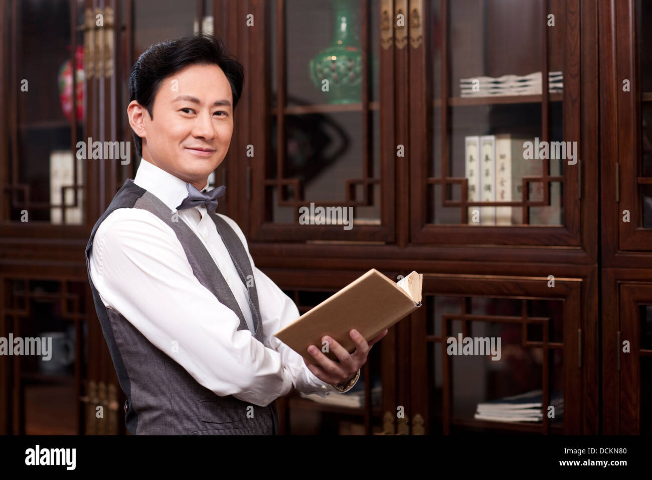 Fine gentleman reading a book Stock Photo - Alamy