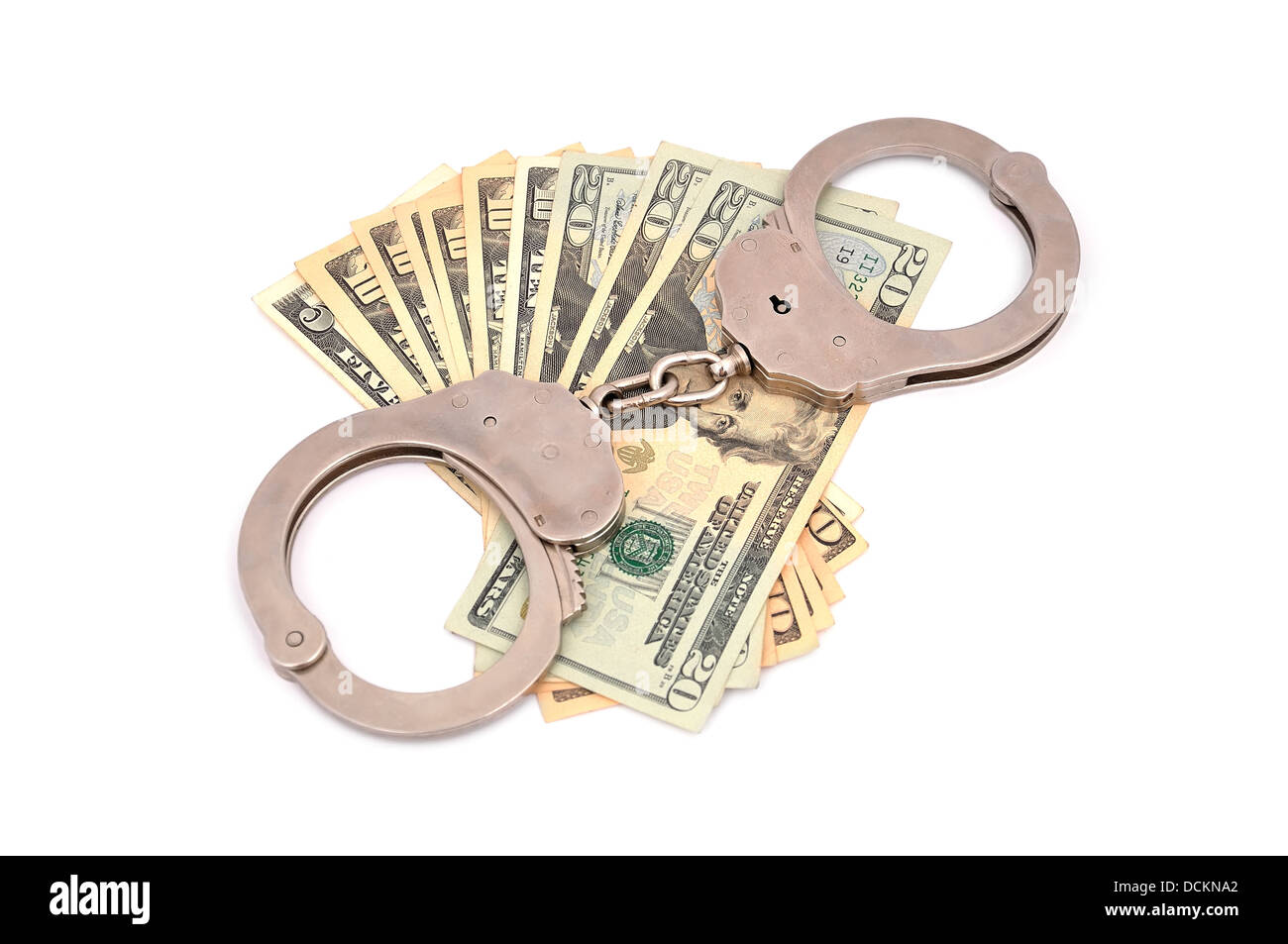 handcuffs and dollars Stock Photo - Alamy