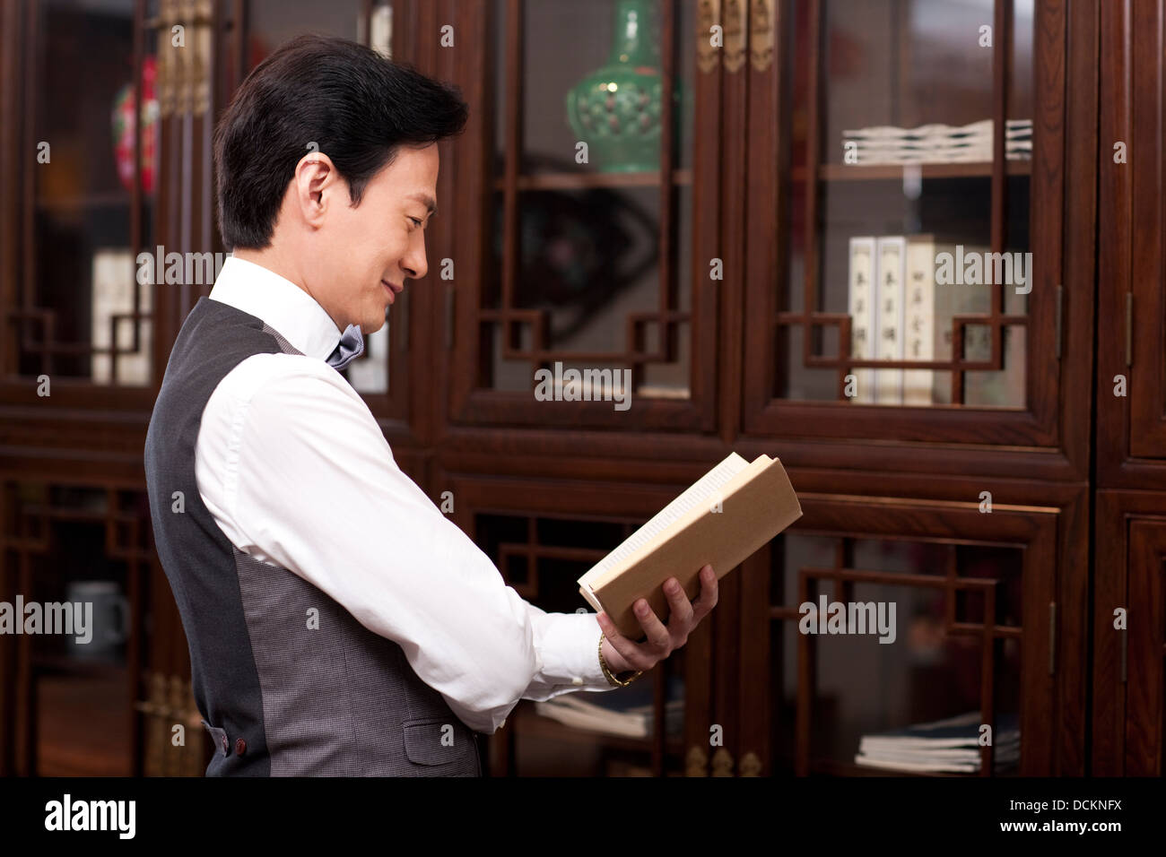 Fine gentleman reading a book Stock Photo - Alamy