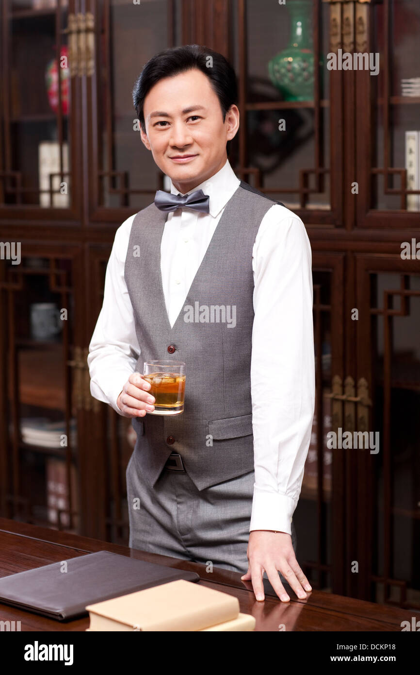 Wealthy businessman with wine Stock Photo - Alamy