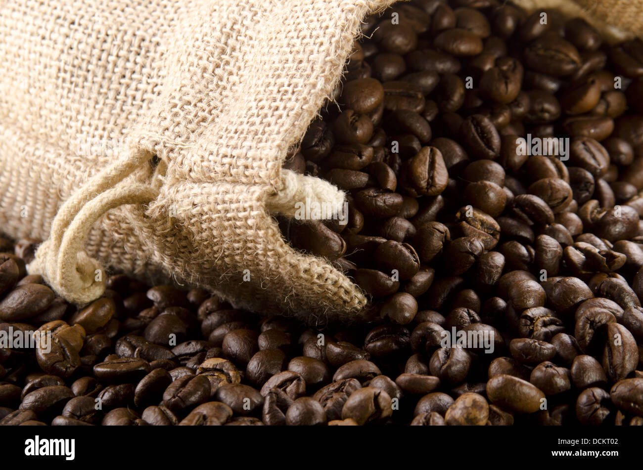 freshly roasted coffee beans in a jute bag Stock Photo - Alamy
