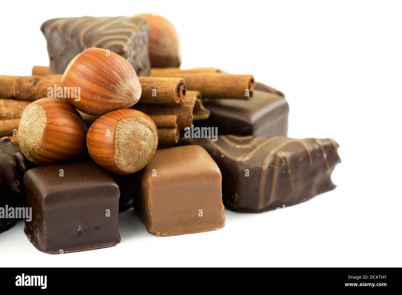 chocolate, hazelnuts, cinnamon sticks Stock Photo - Alamy