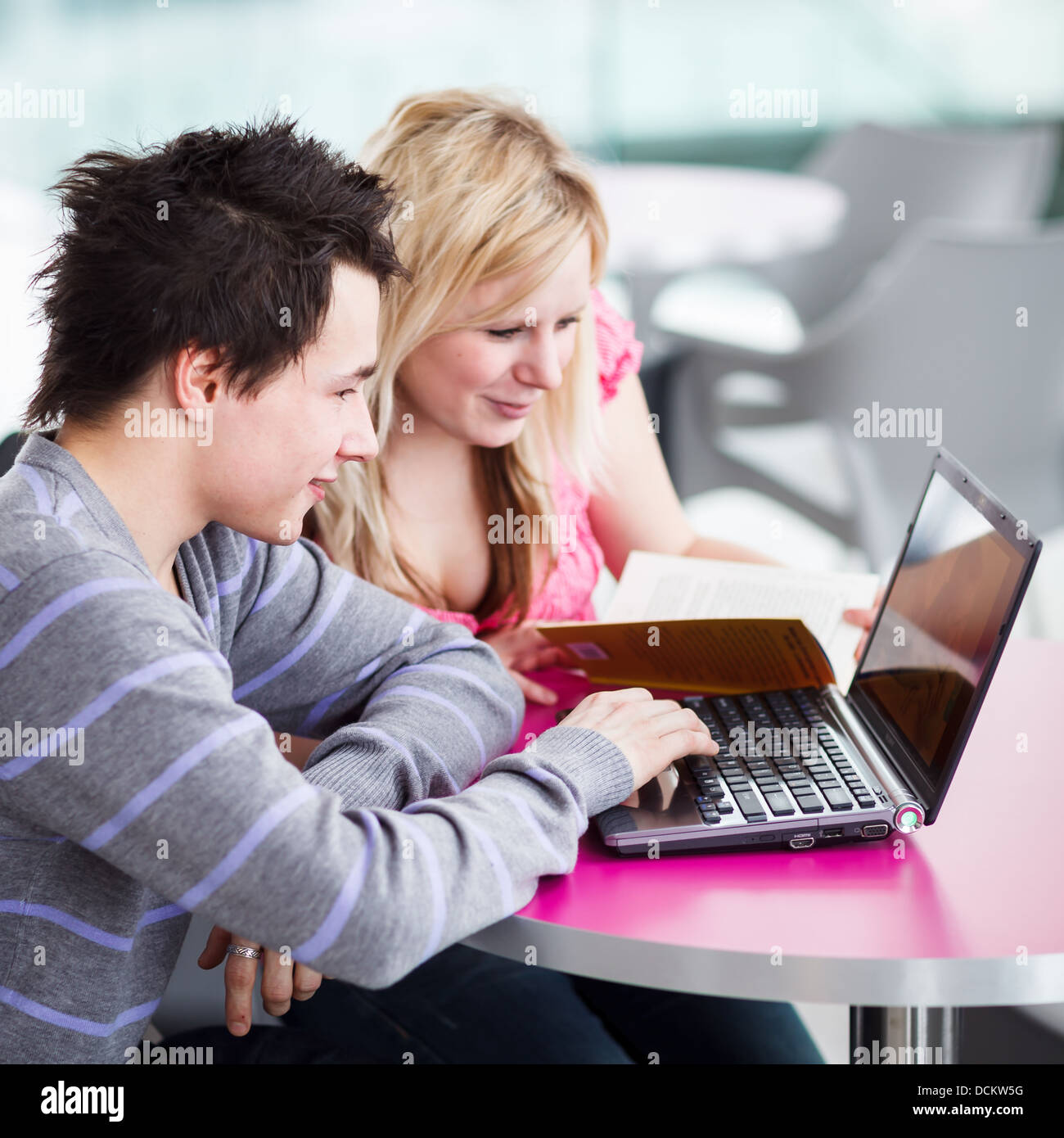 Two college students having fun studying together Stock Photo - Alamy