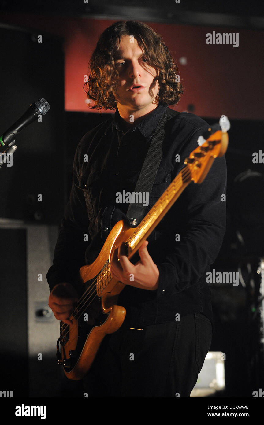 Nick O'Malley of The Arctic Monkeys performing at Revolution Live Fort ...