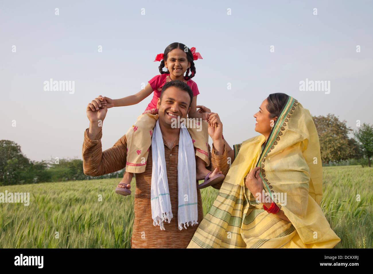 Portrait of a cheerful rural family in the field Stock Photo - Alamy