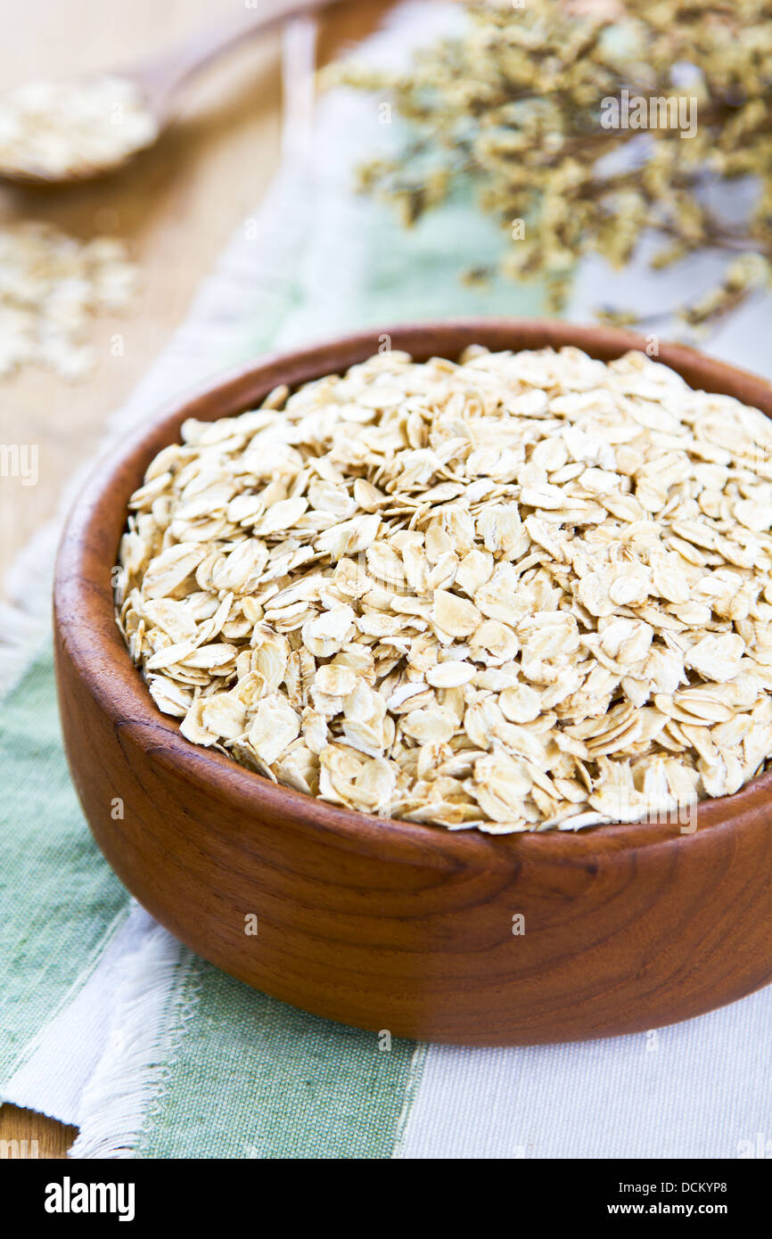 Rolled Oat in a wood bowl Stock Photo - Alamy