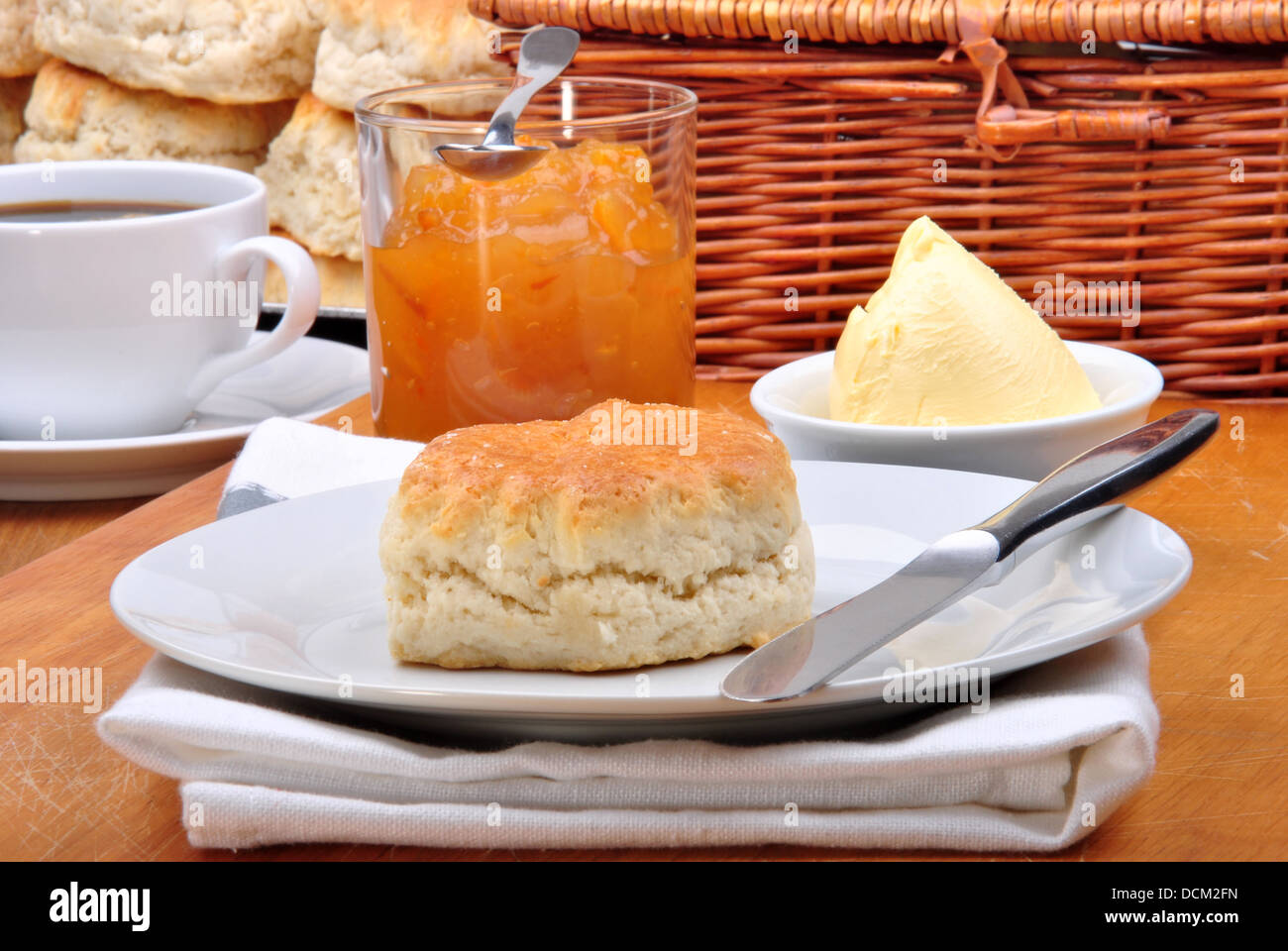 scone with organic jam on a white plate Stock Photo - Alamy