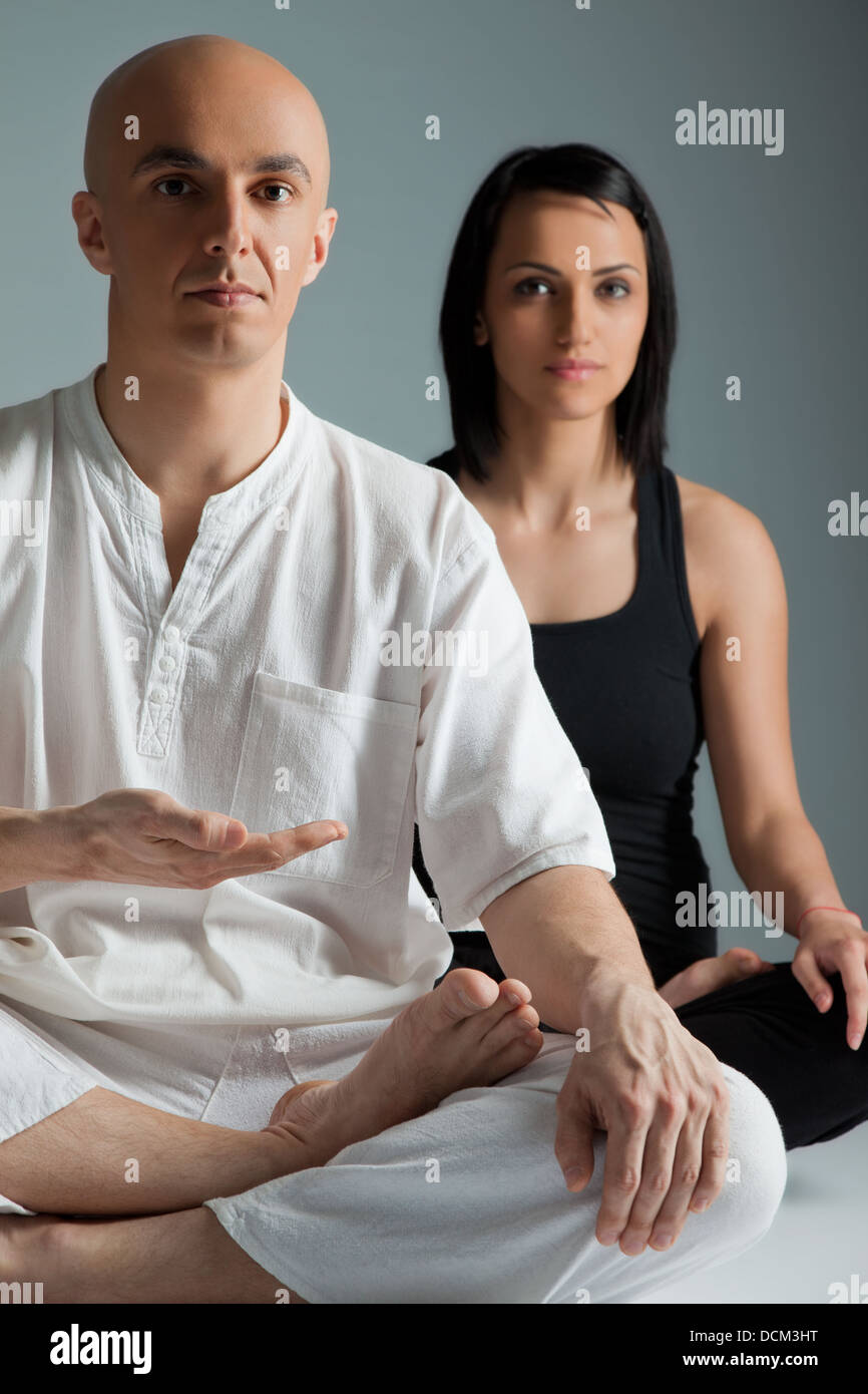 Couple yoga meditation Stock Photo - Alamy
