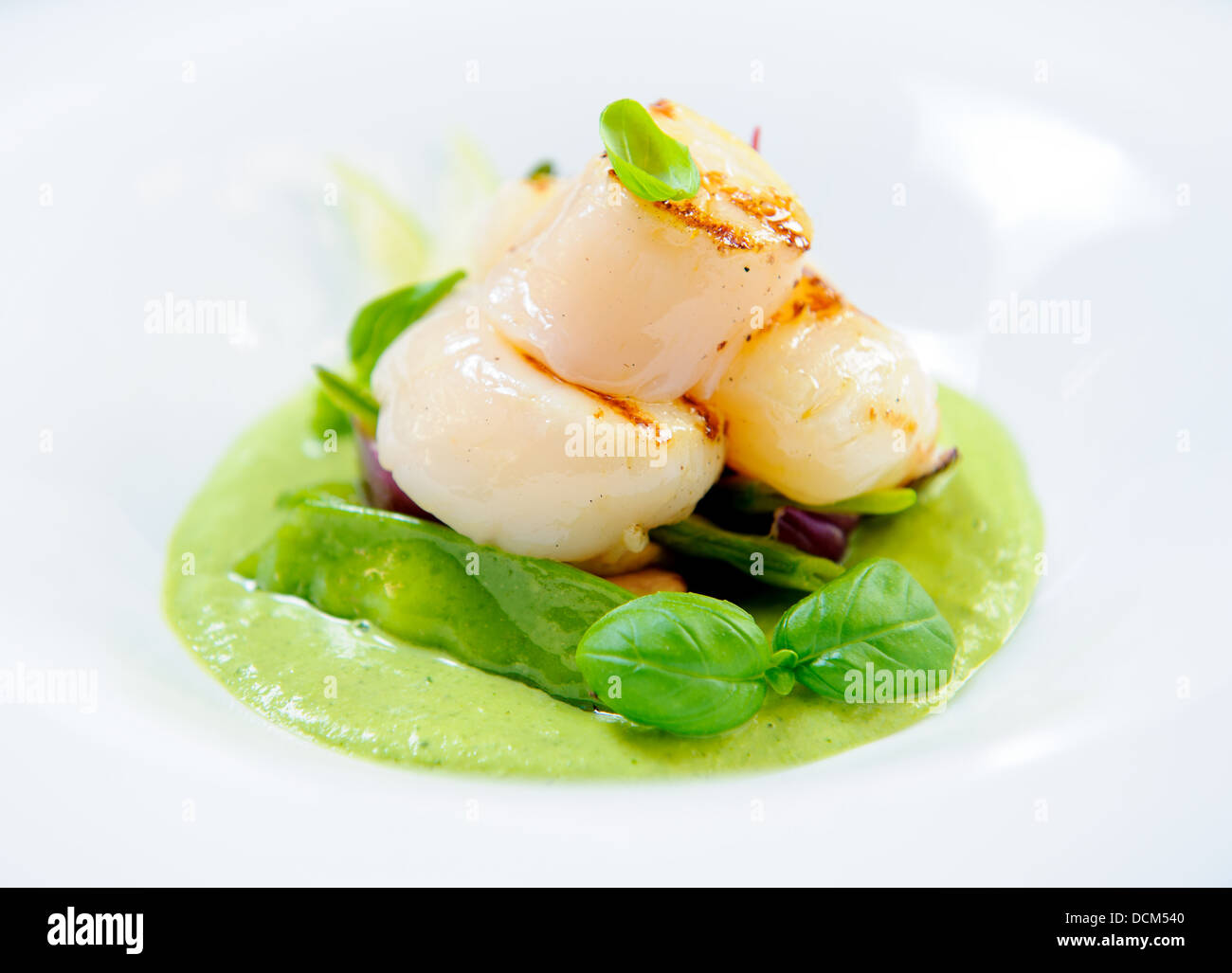 Fish fillet with green curry Stock Photo - Alamy