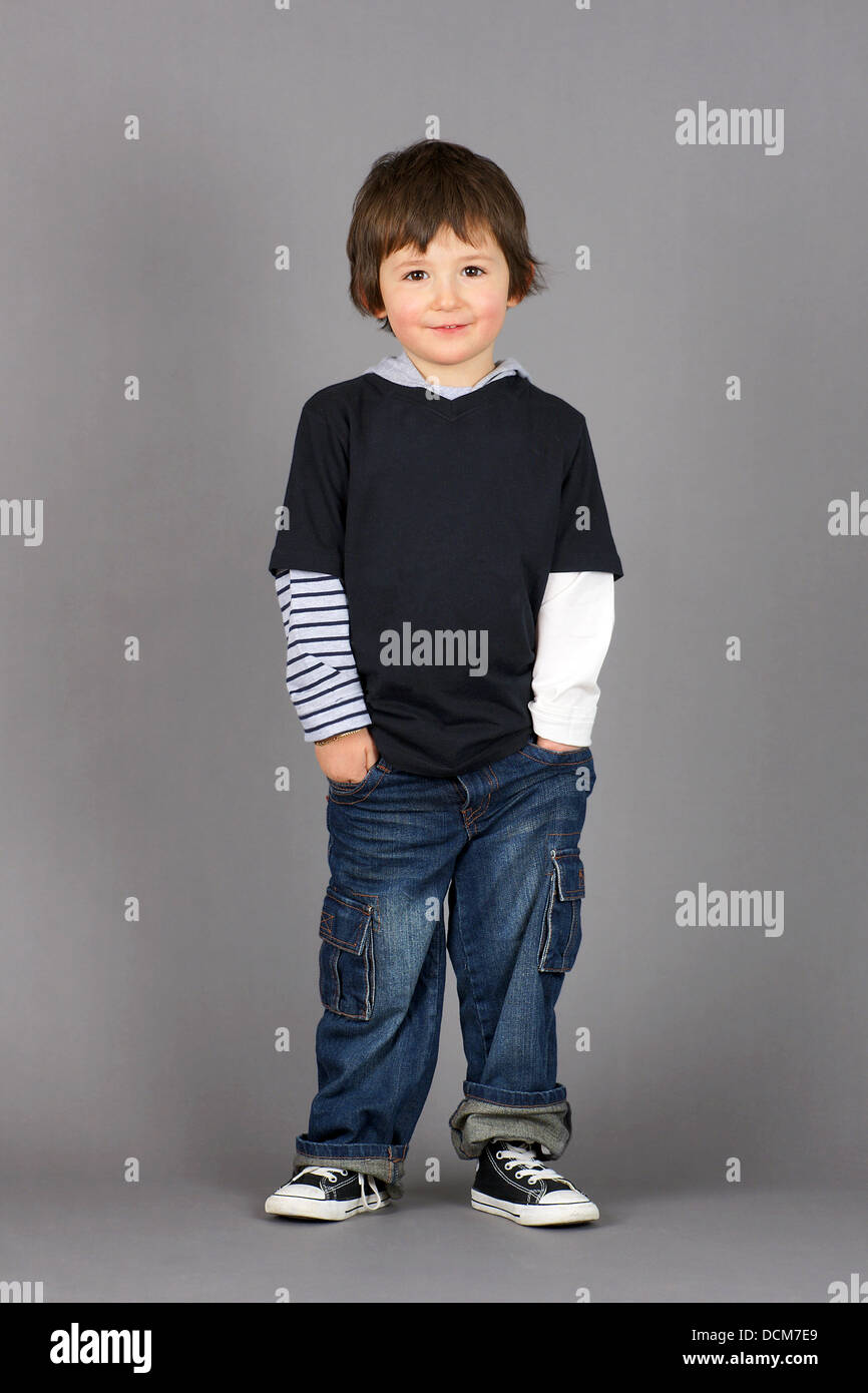 Boy with hands in pockets Stock Photo - Alamy