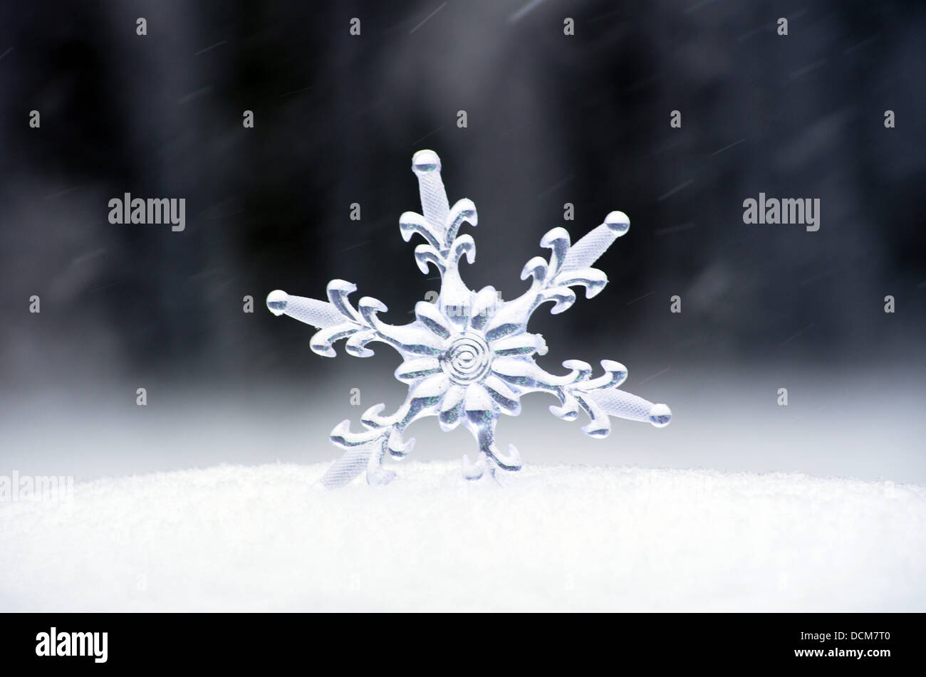 Snowflake in snow Stock Photo - Alamy