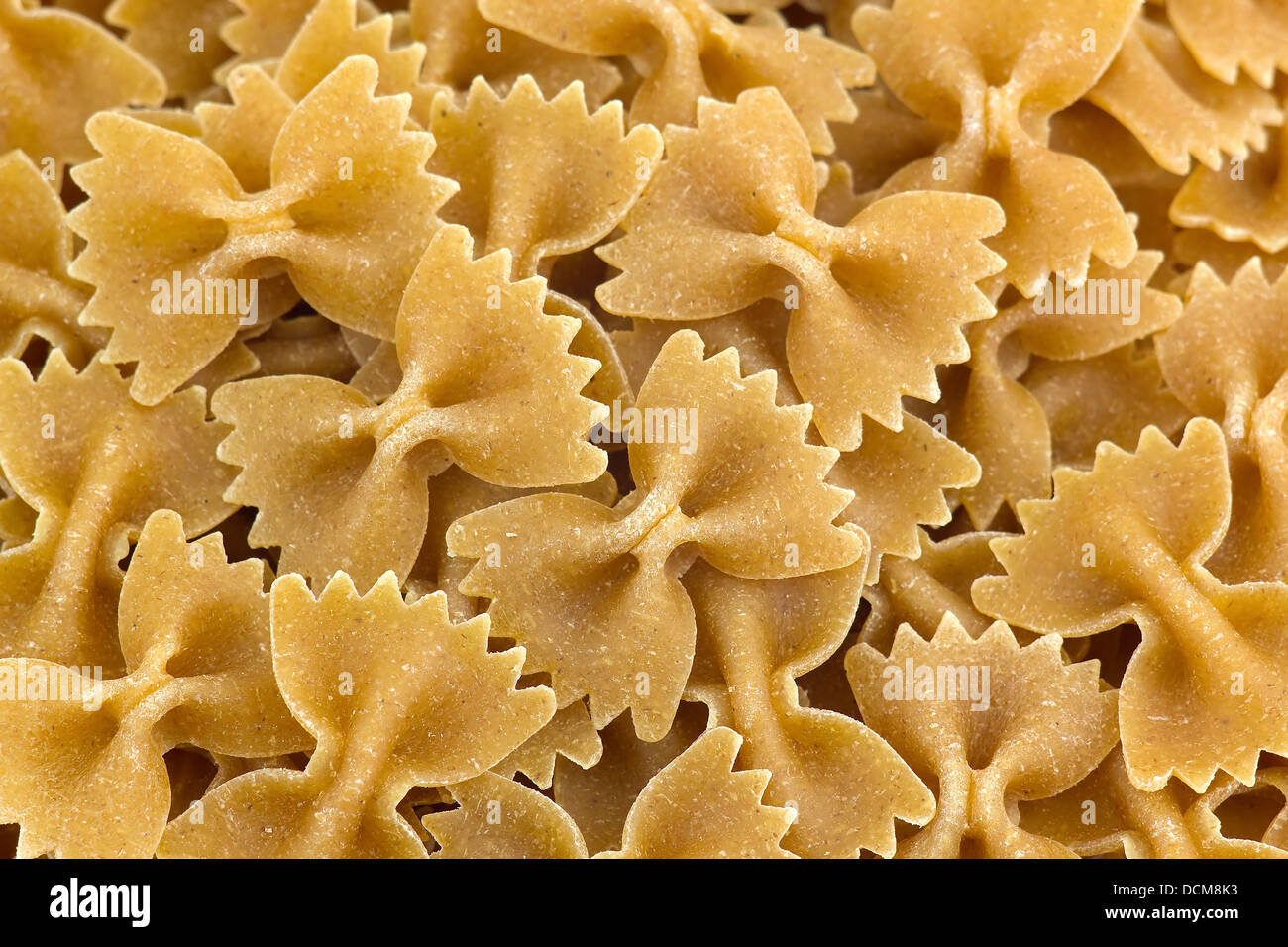 whole grain farfalle pasta close up Stock Photo - Alamy