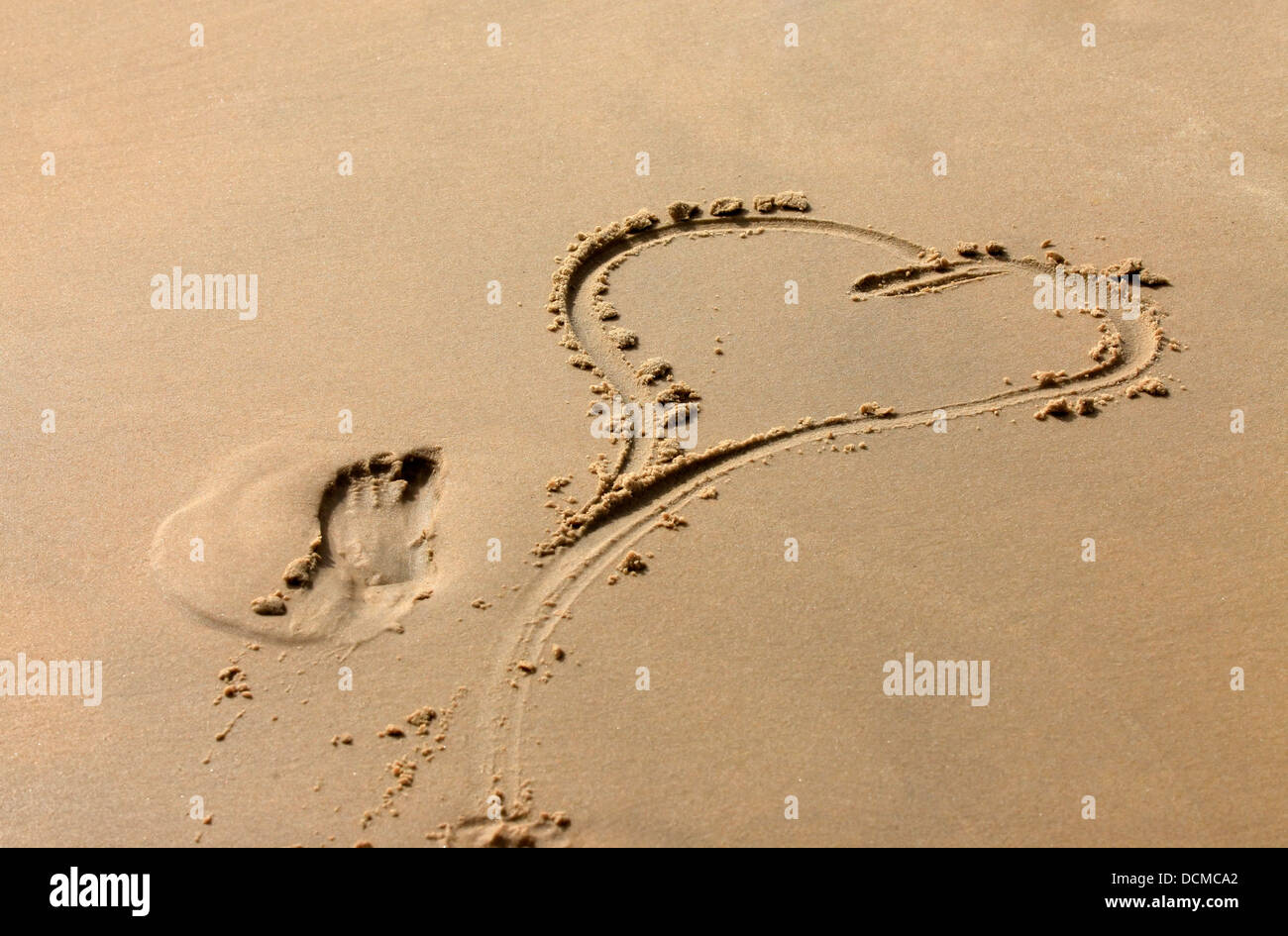 Heart on sand Stock Photo - Alamy