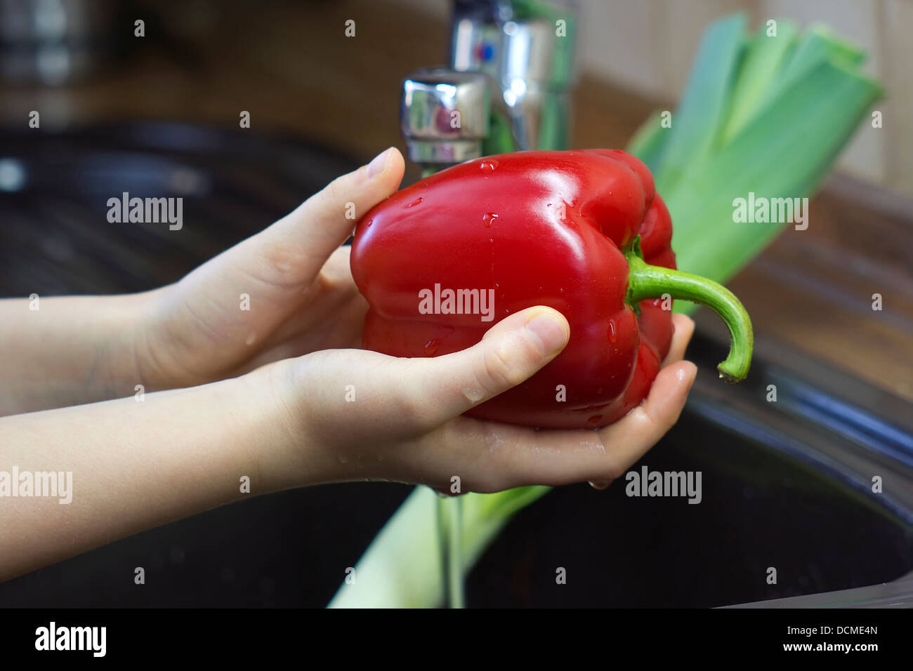 Child wash vegetables sink hi-res stock photography and images - Alamy