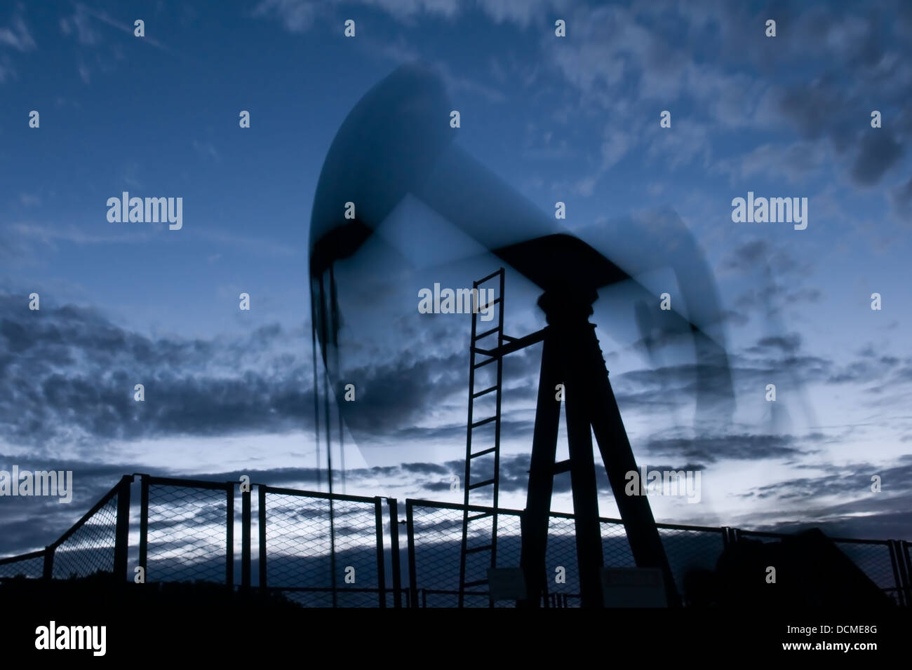 oil rig silhouette working at sunset lighting Stock Photo - Alamy