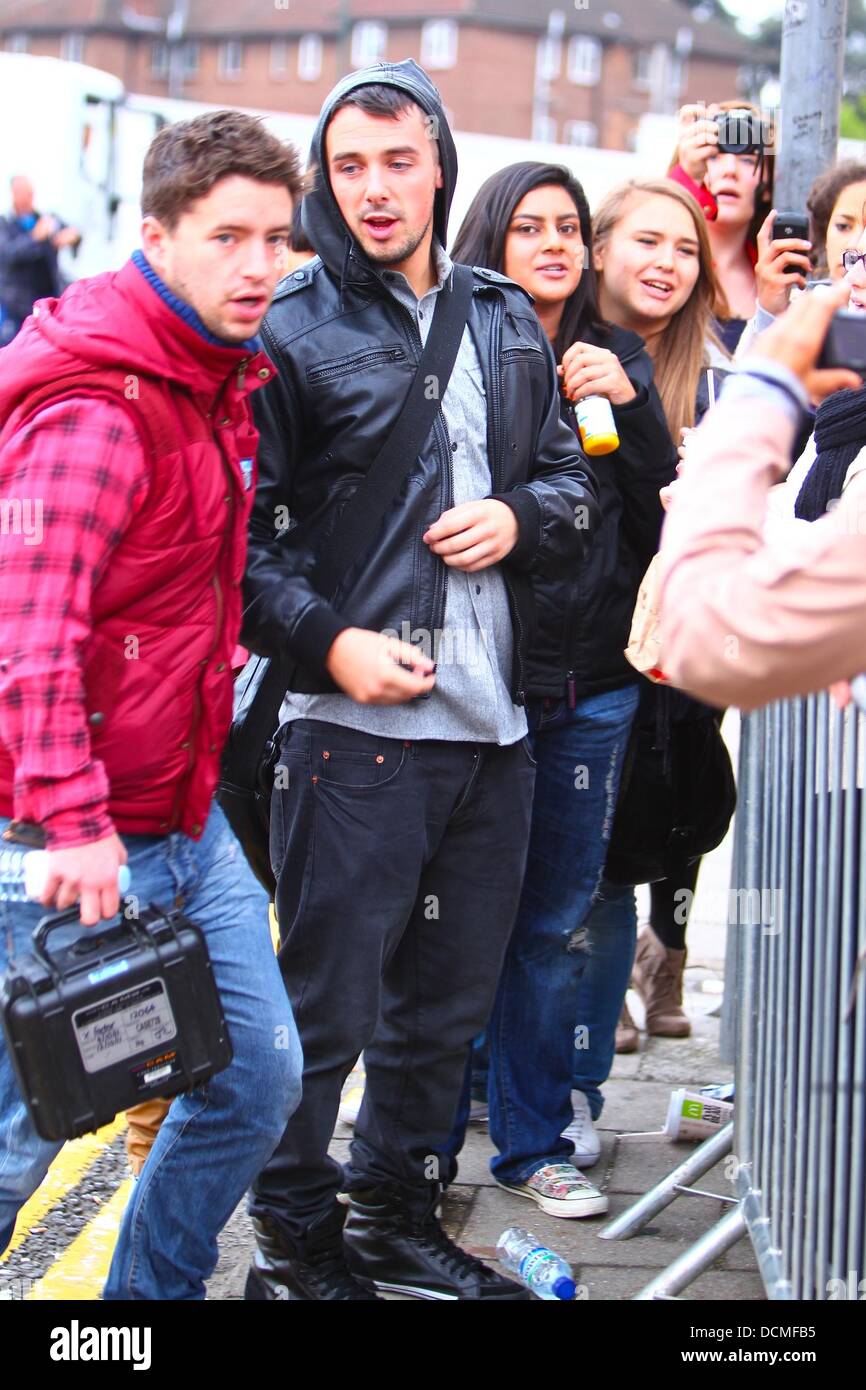 Charlie Healy of The Risk takes time to talk to fans as he arrives at ...