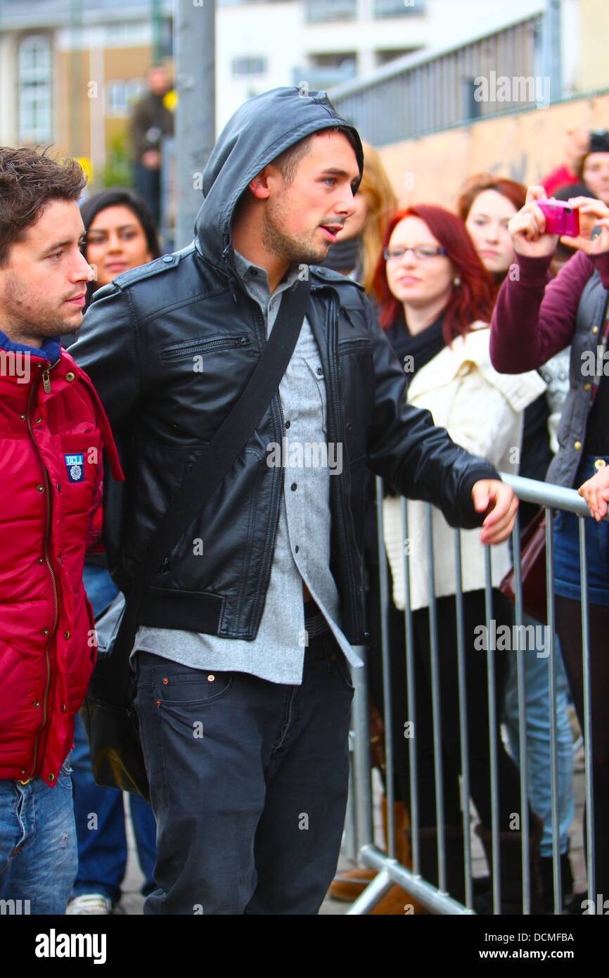 Charlie Healy of The Risk takes time to talk to fans as he arrives at ...
