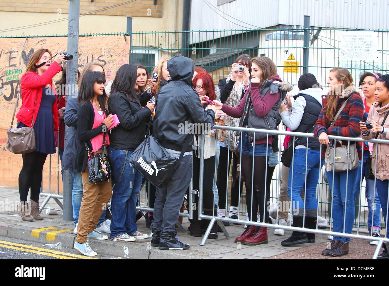 Charlie Healy of The Risk takes time to talk to fans as he arrives at ...