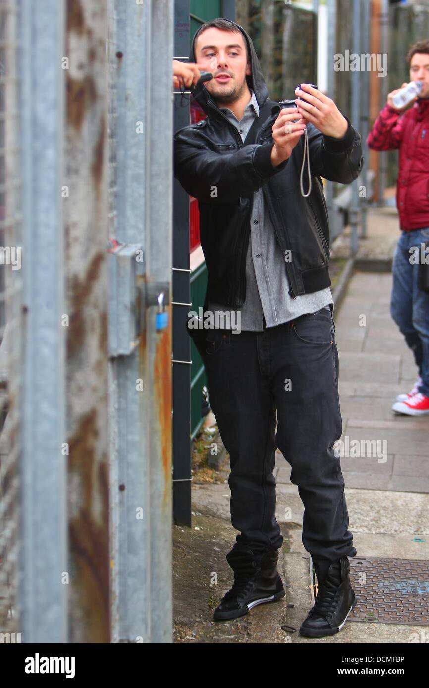 Charlie Healy of The Risk takes time to talk to fans as he arrives at ...