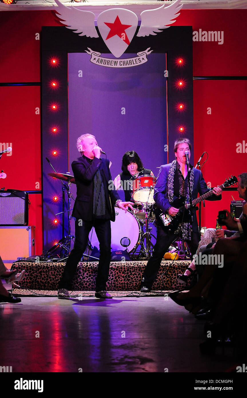 Jimmy Kunes, drummer Marky Ramone and Andy Hilfiger performs after his ...