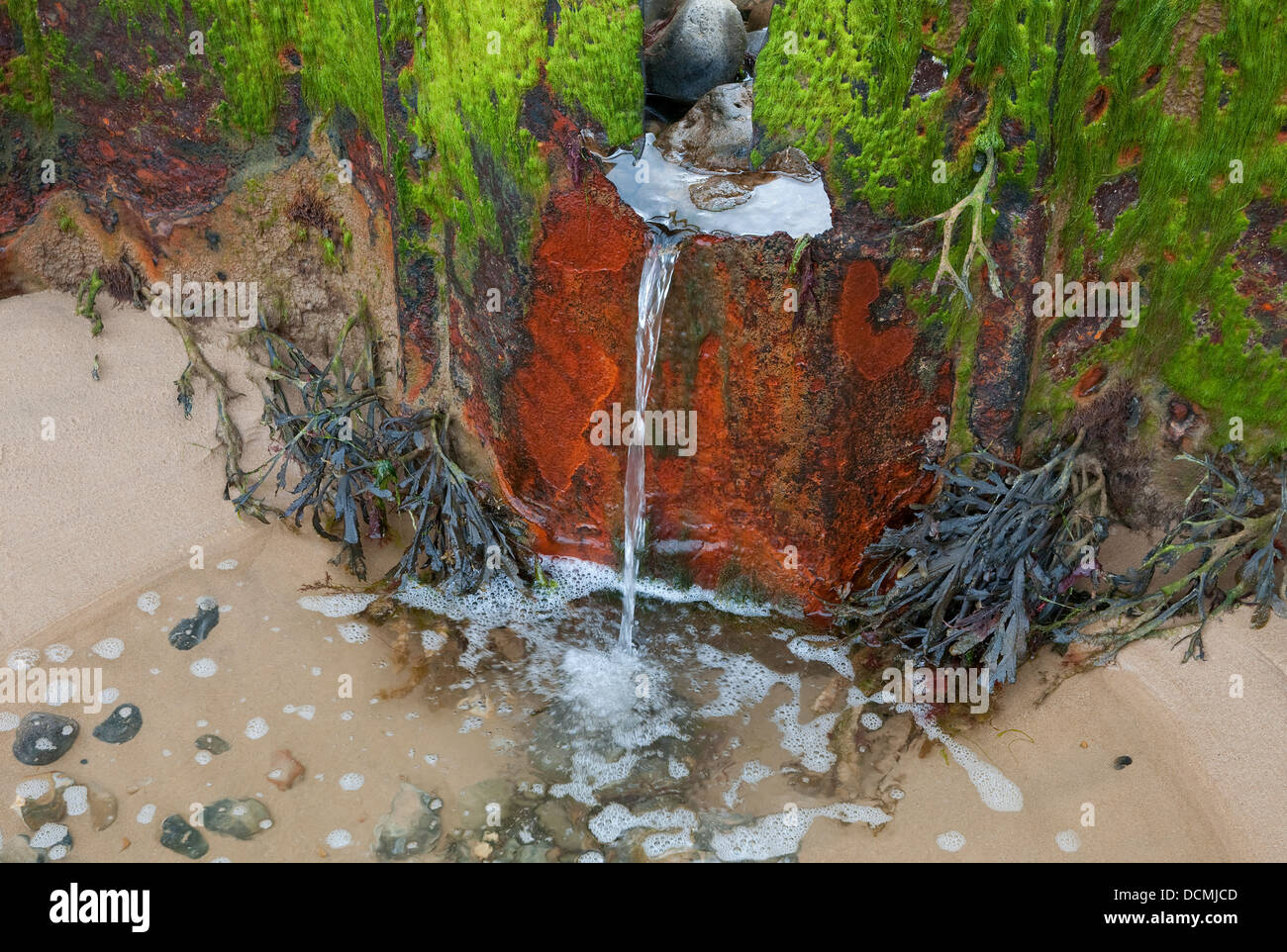 natural water feature on beach, west runton, norfolk, england Stock ...