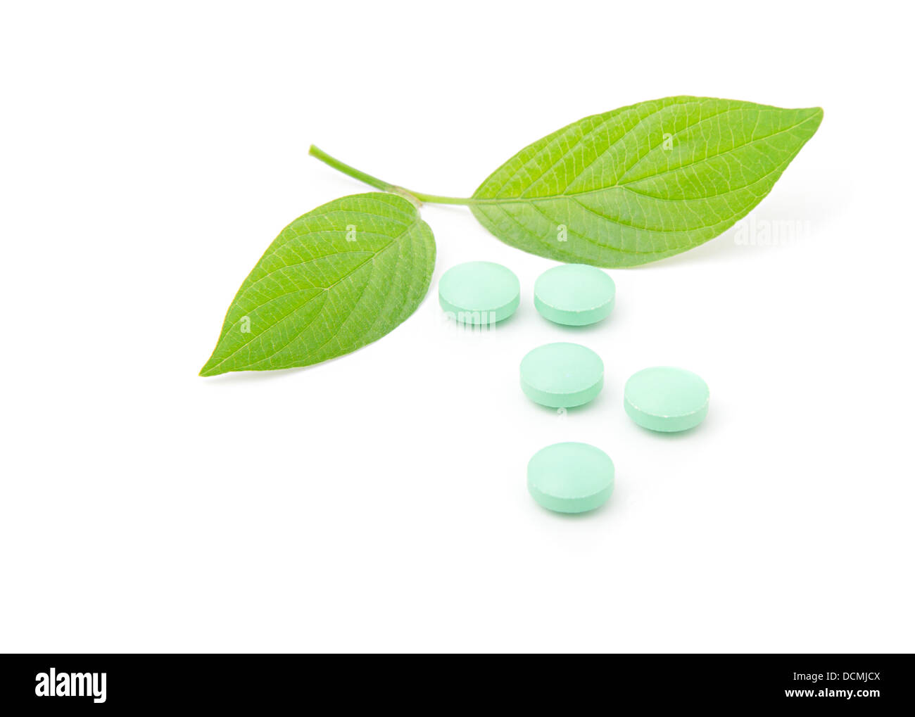 Pills with green leaf isolated on a white background. Herbal Medicine ...