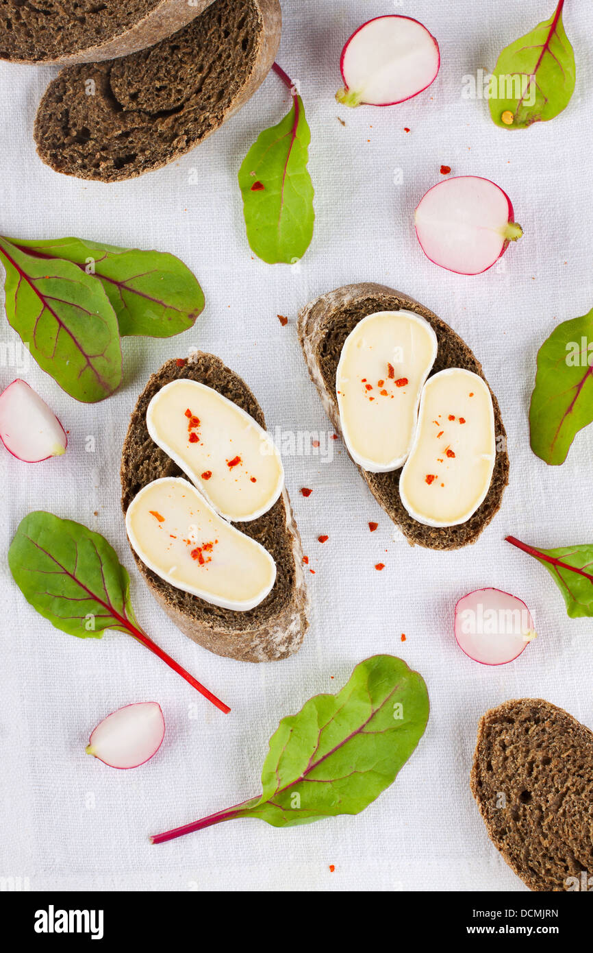 Rye bread canapes with soft cheese and red pepper Stock Photo - Alamy