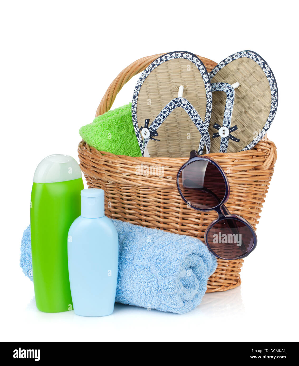 Beach items in basket. Isolated on white background Stock Photo - Alamy