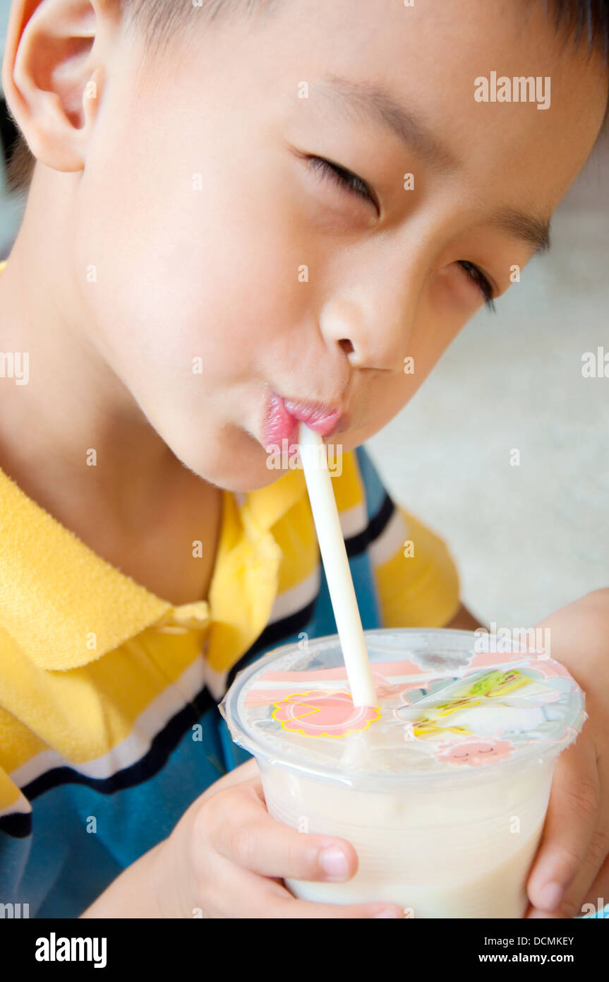 Young boy and a drink Stock Photo - Alamy