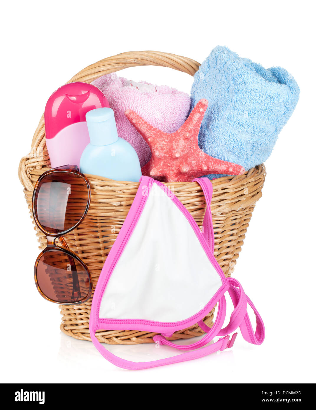 Beach items in basket. Isolated on white background Stock Photo - Alamy