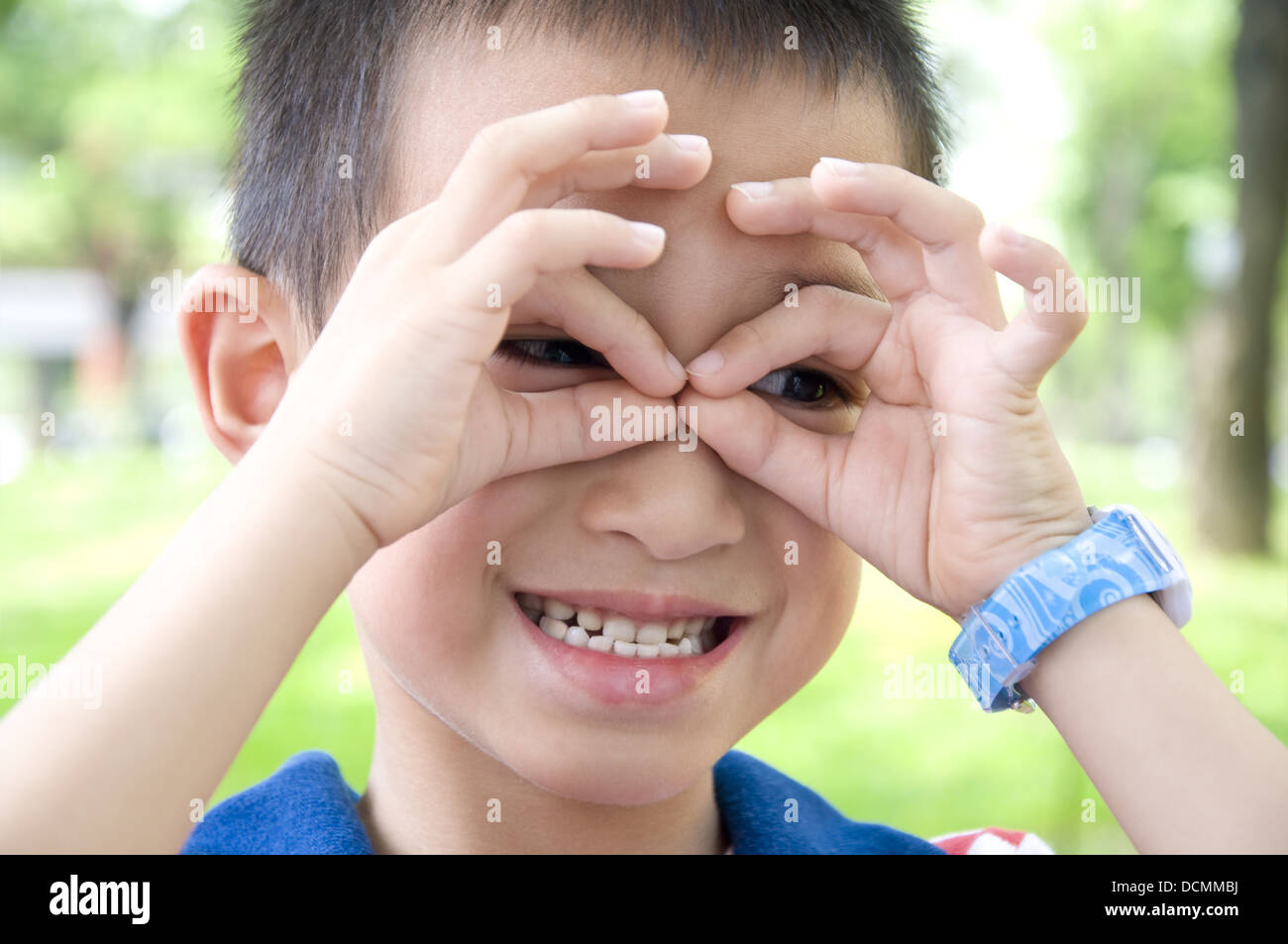 cute boy watch right with his hand Stock Photo - Alamy