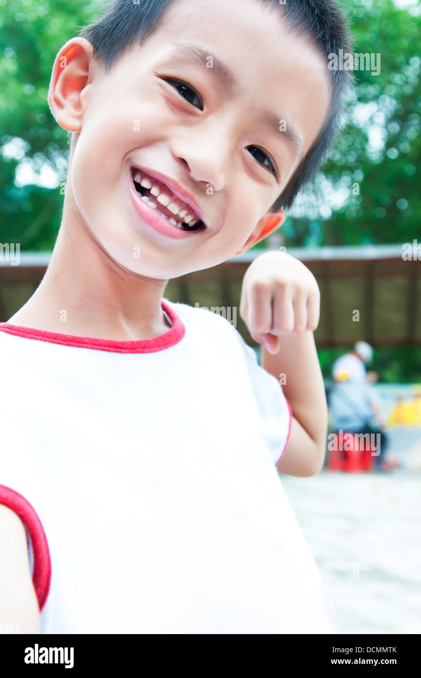Happy smiling boy in the park Stock Photo - Alamy