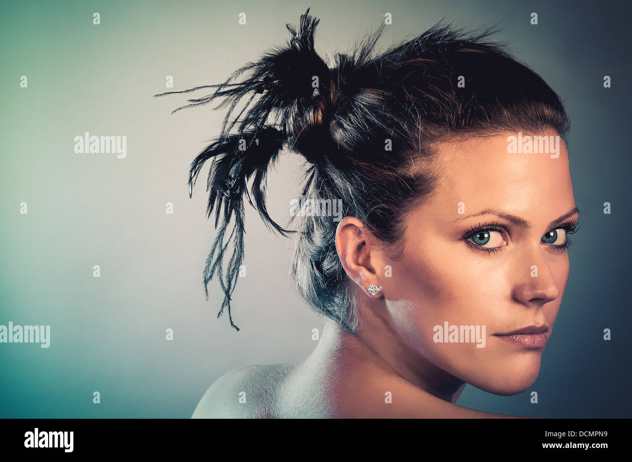 Studio girl with green background looking back at camera Stock Photo ...