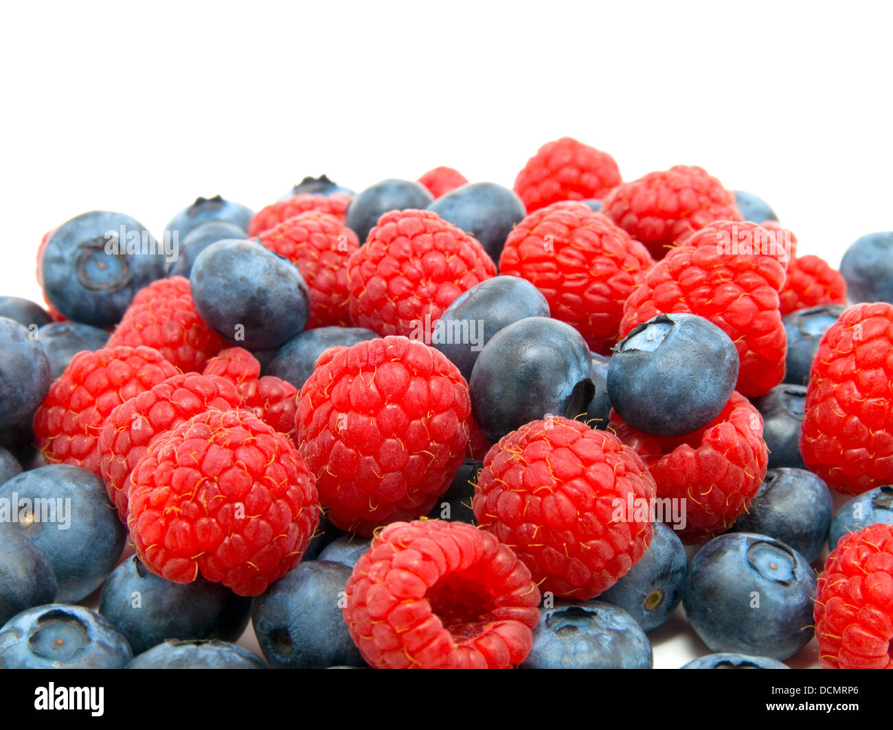 Blueberry and raspberries on white background Stock Photo - Alamy
