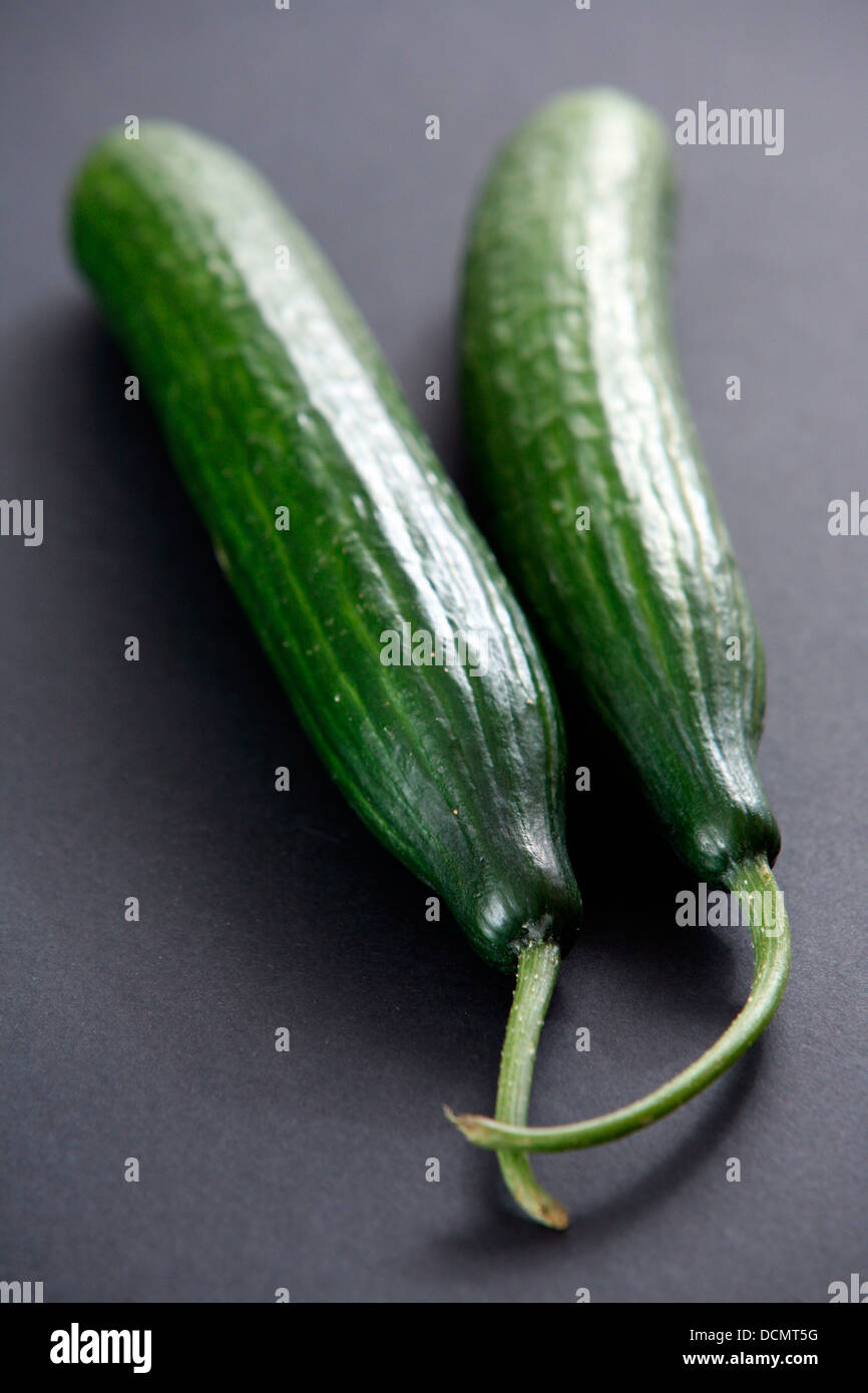 Cucumbers, black background Stock Photo - Alamy