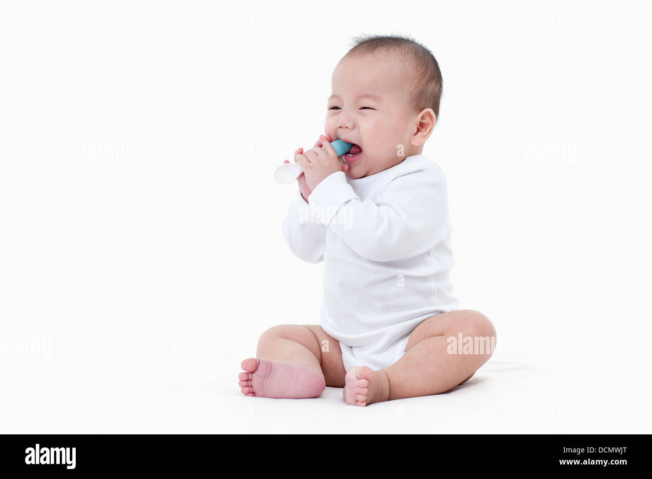 a baby with a spoon Stock Photo - Alamy