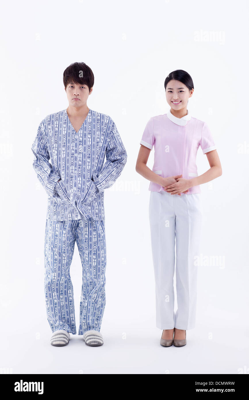 a patient and a nurse standing together Stock Photo - Alamy