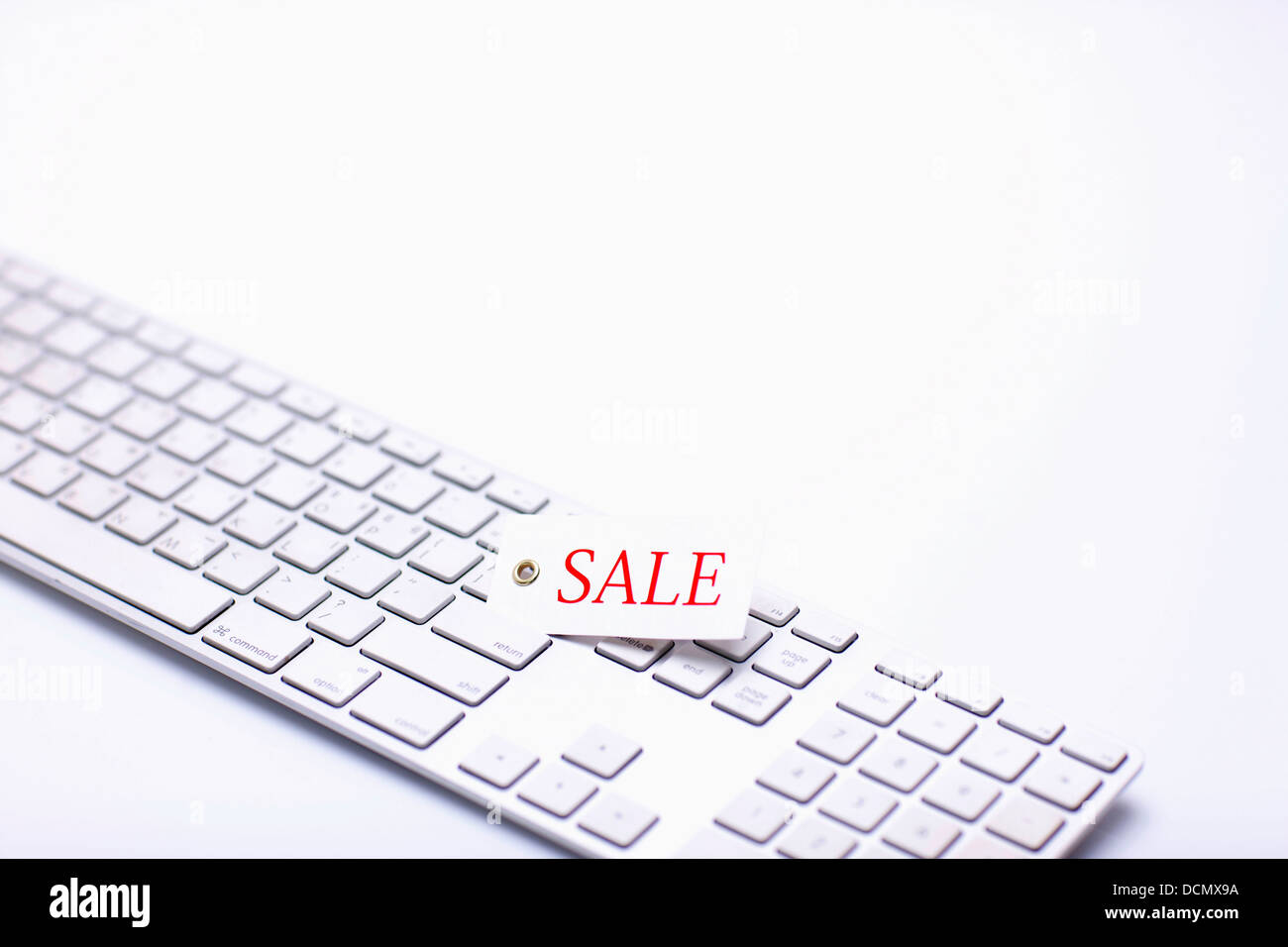 a keyboard with a memo saying sale Stock Photo - Alamy