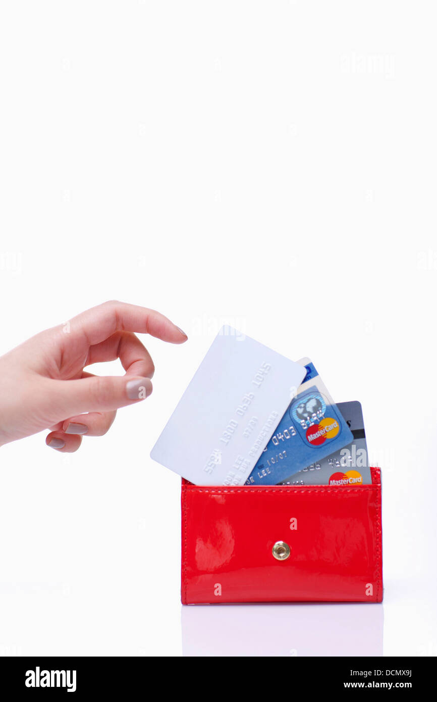 a hand taking credit cards from a wallet Stock Photo - Alamy