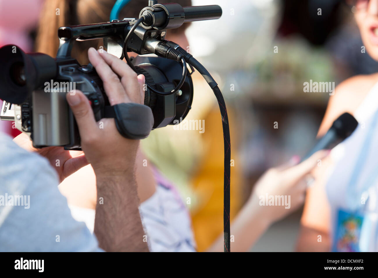 journalist hand holding a microphone conducting an TV or radio ...