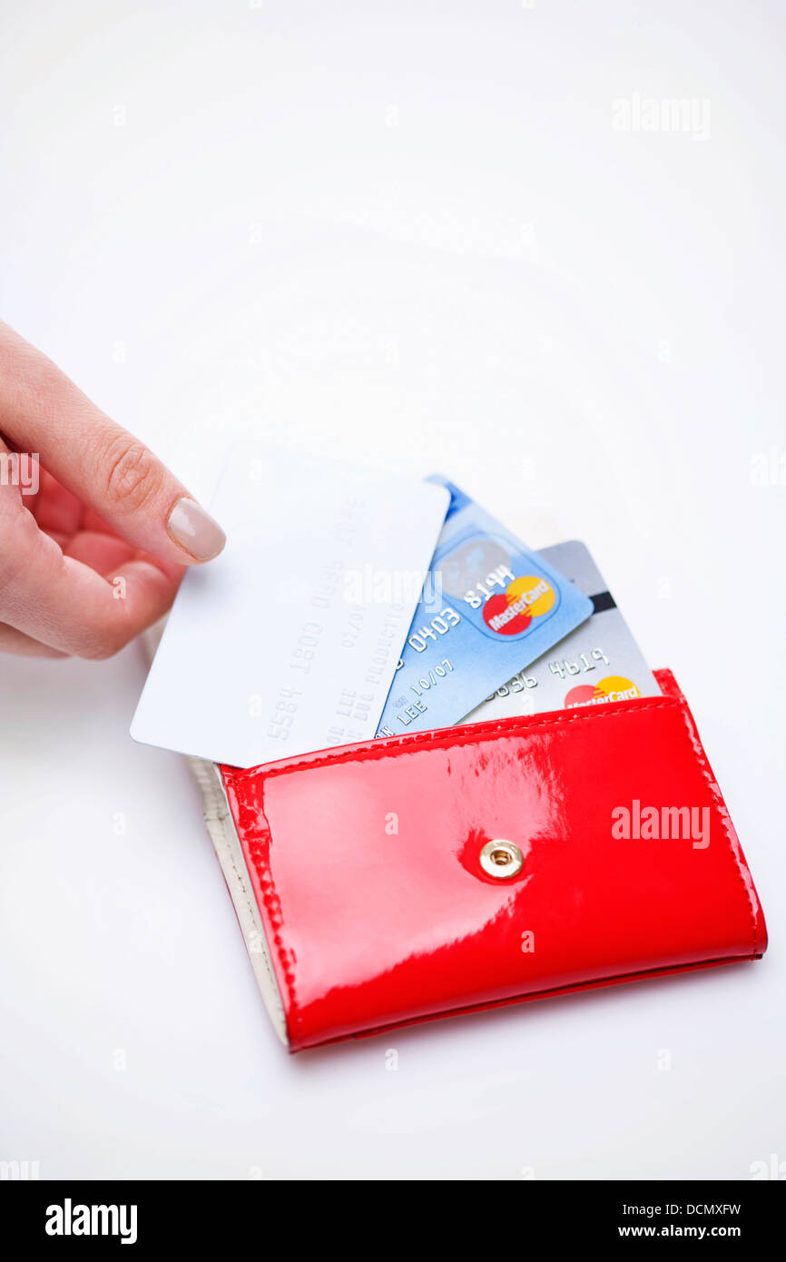 a hand taking credit cards from a wallet Stock Photo - Alamy