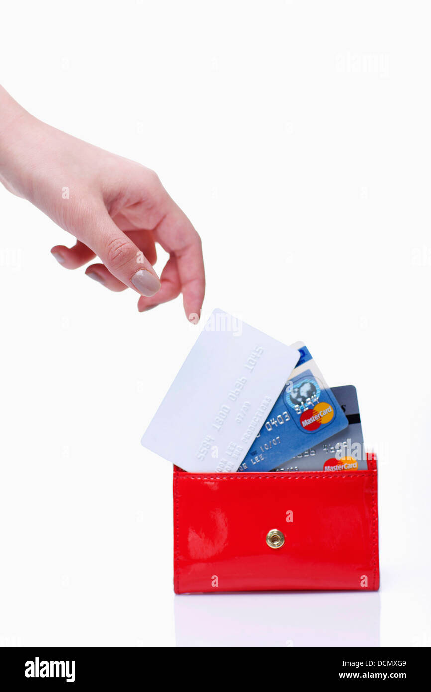 a hand taking credit cards from a wallet Stock Photo - Alamy