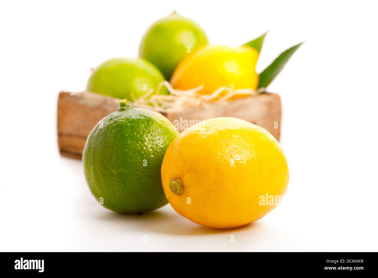 yellow and green lemon over white background Stock Photo - Alamy